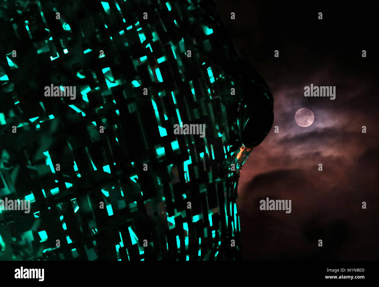 A blue moon rises over the Kelpies in Central Scotland Stock Photo - Alamy