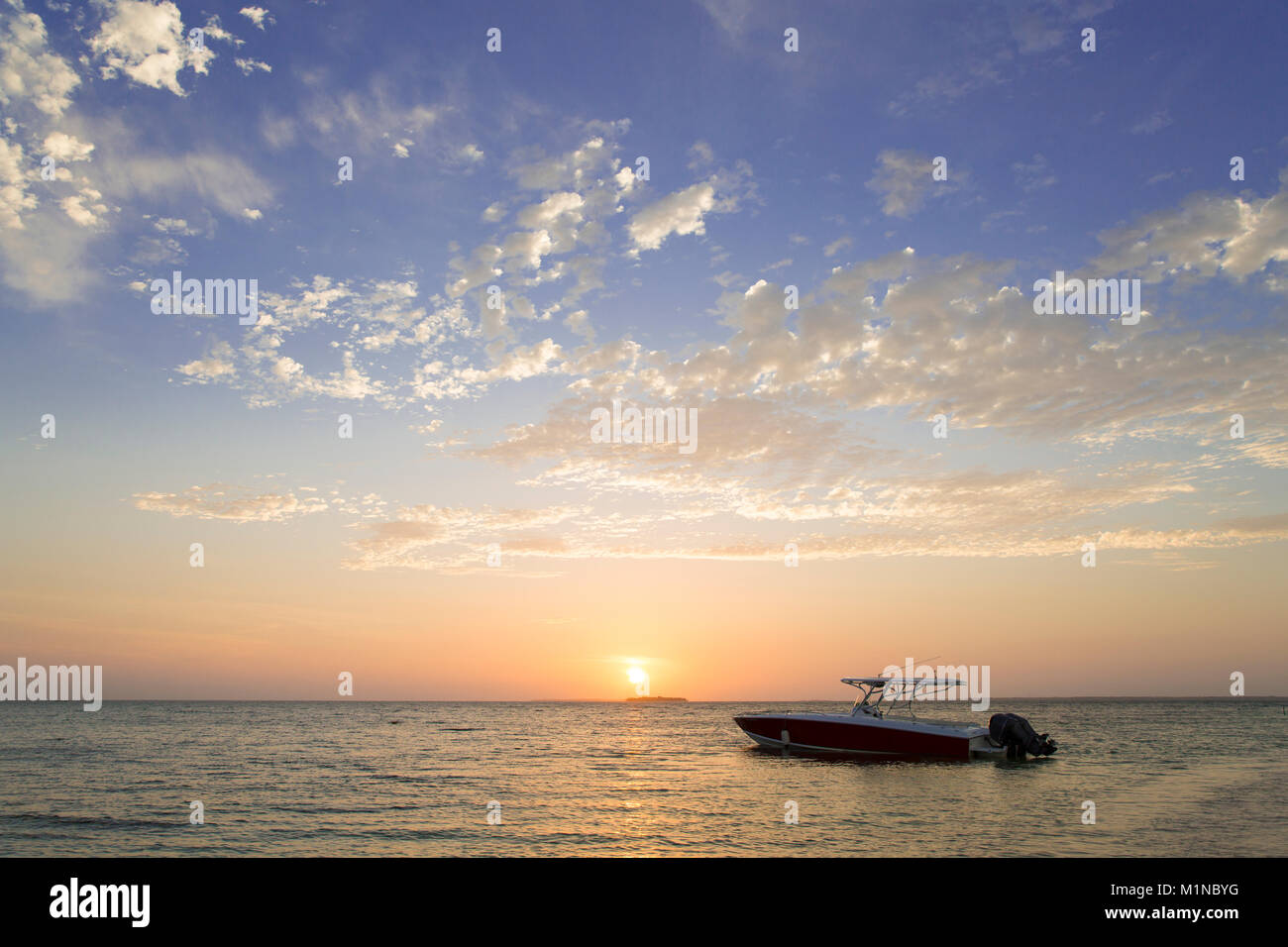 Sailboat at beautiful Island and sunset Stock Photo - Alamy