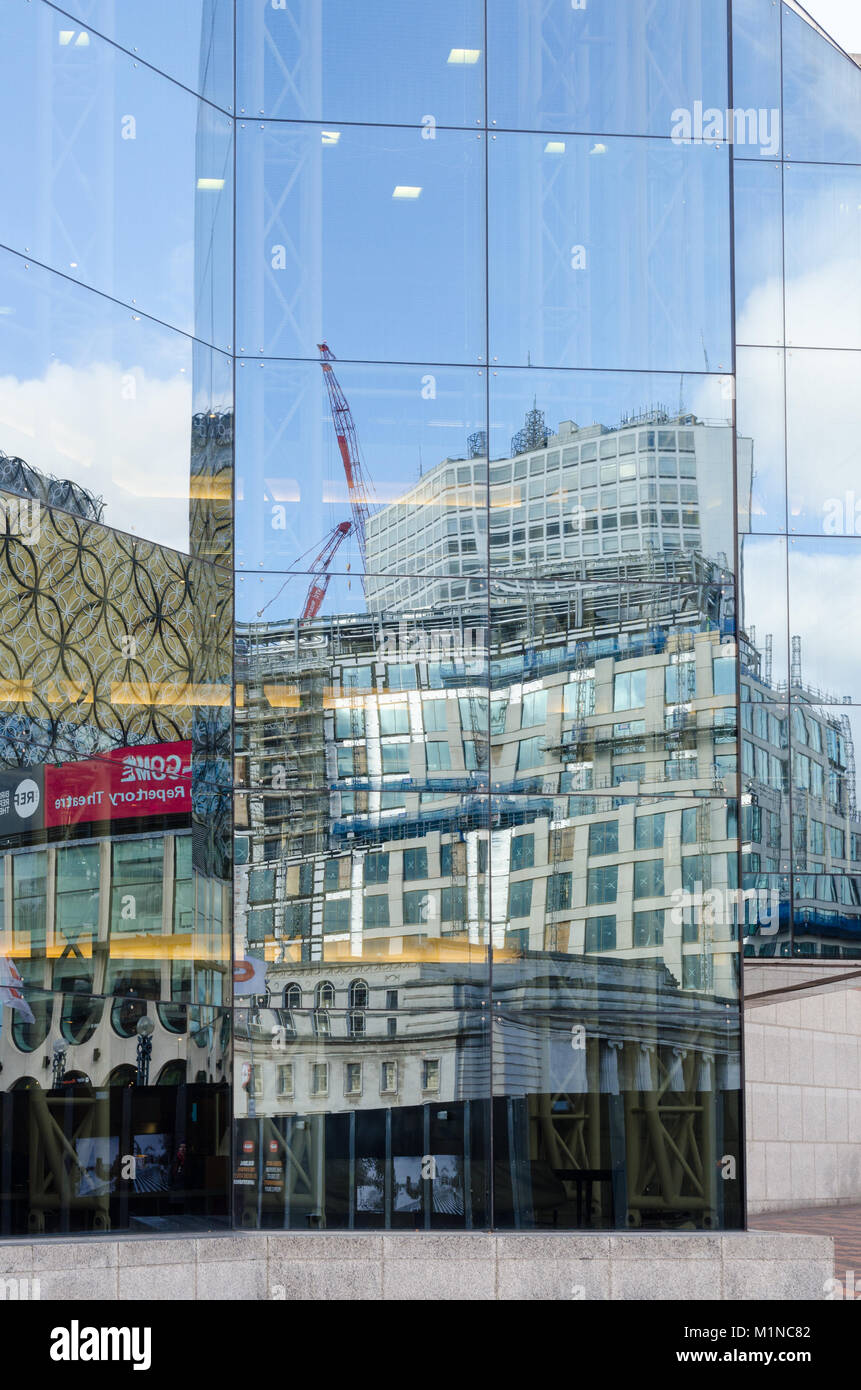The new Library of Birmingham in Centenary Square reflected in glass ...