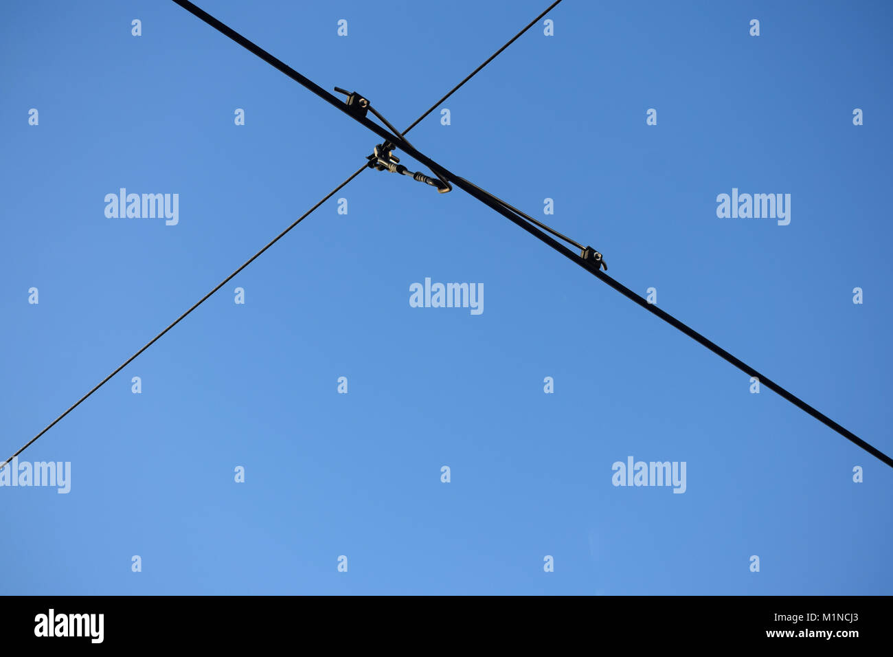 electricity cabels crossing each other Stock Photo - Alamy