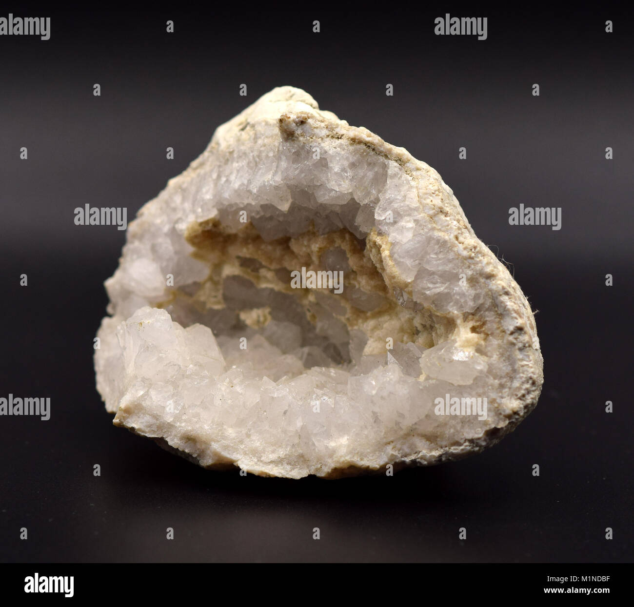 White geode with brilliant white and orange crystals on a seamless ...