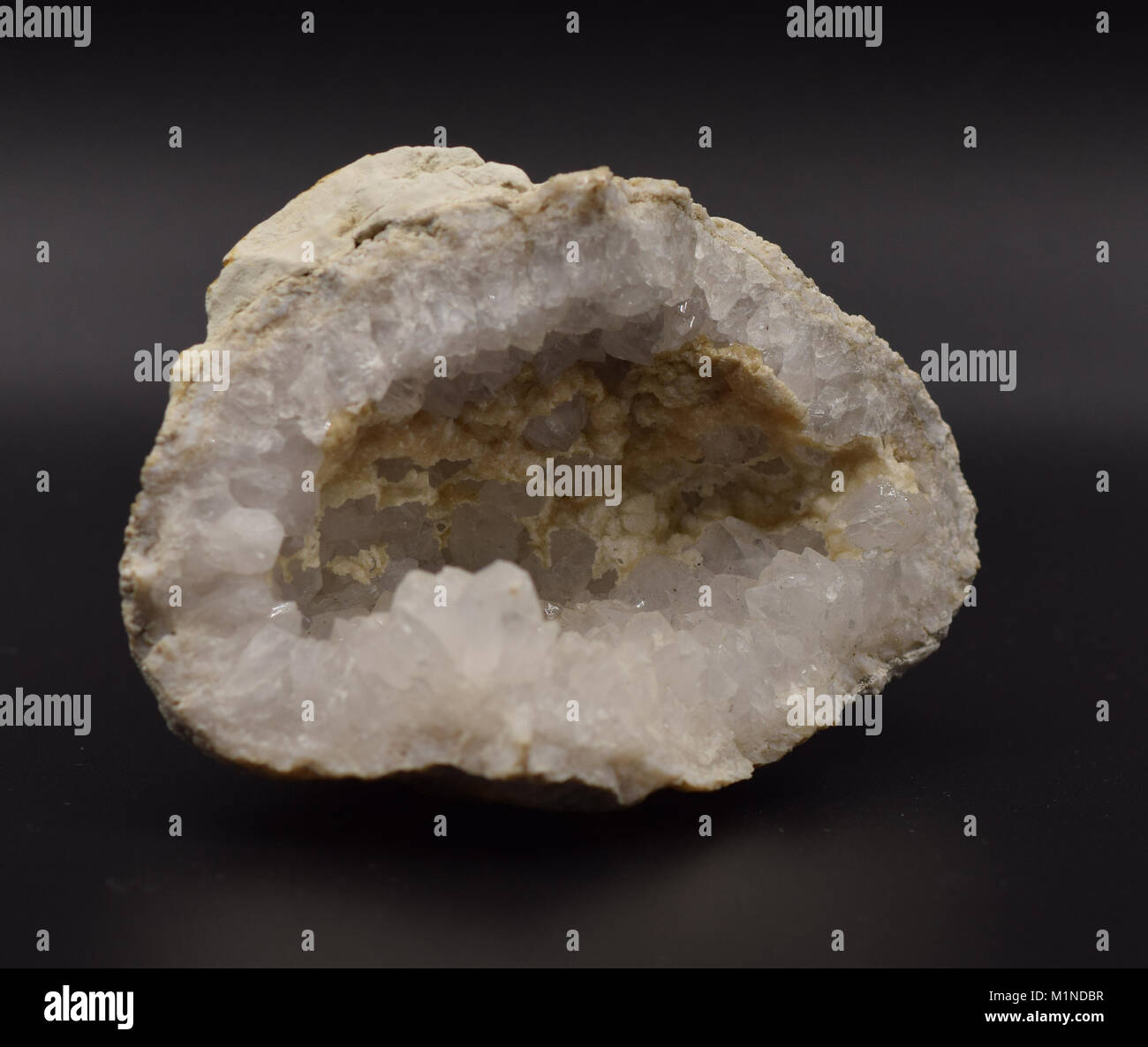 White geode with brilliant white and orange crystals on a seamless ...