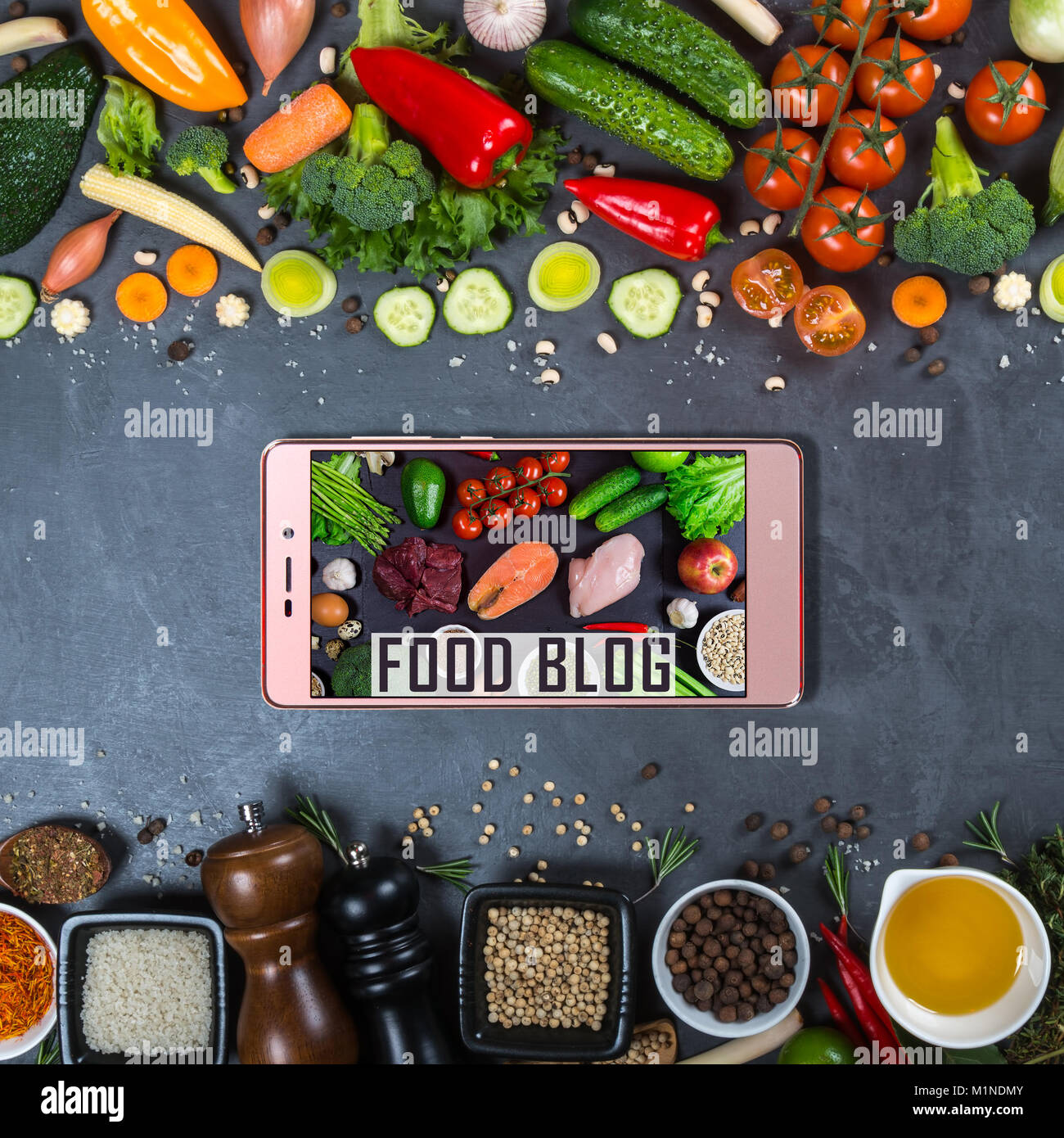Food blog concept. Big set of vegetables, spices and smartphone on a ...