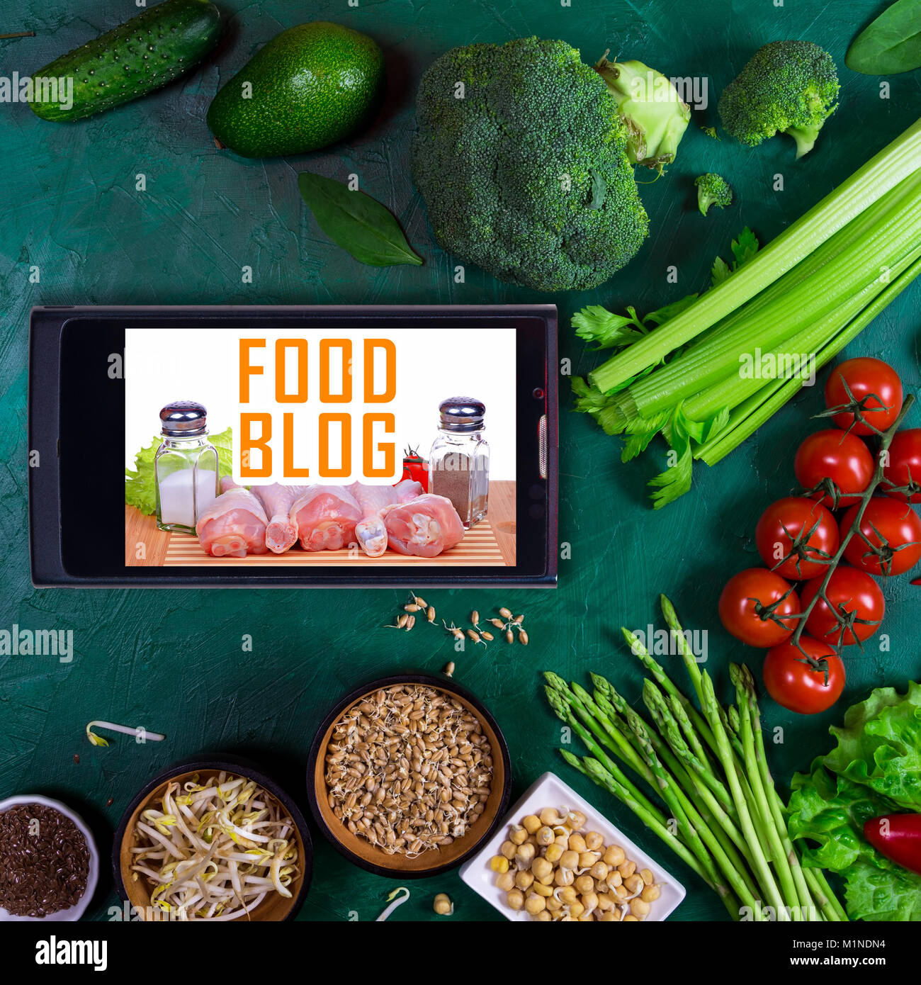 Food blog concept. Big set of vegetables, spices and smartphone on a ...