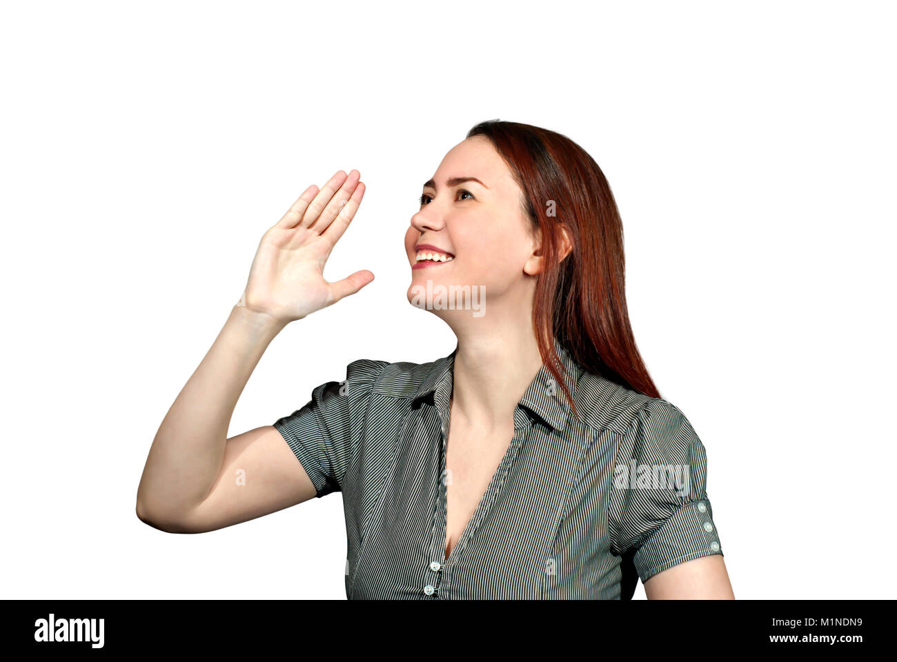 Girl On A White Background Smiling Holding Her Hand In Front Of Her And