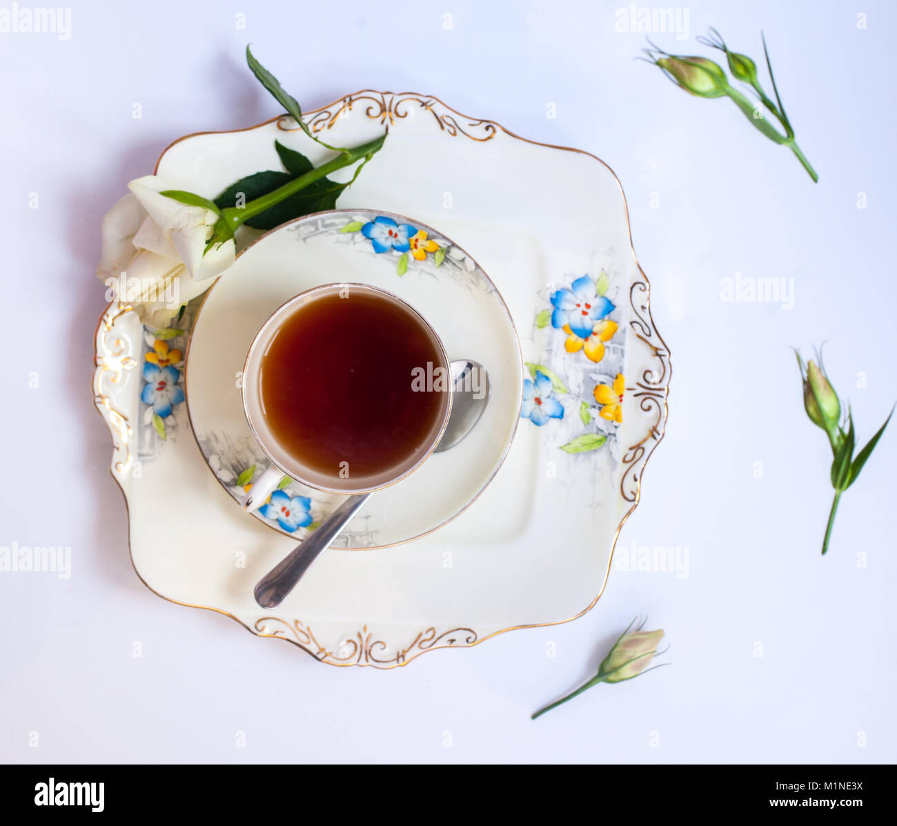 flatlay with elegant tea set surrounde by flowers Stock Photo - Alamy