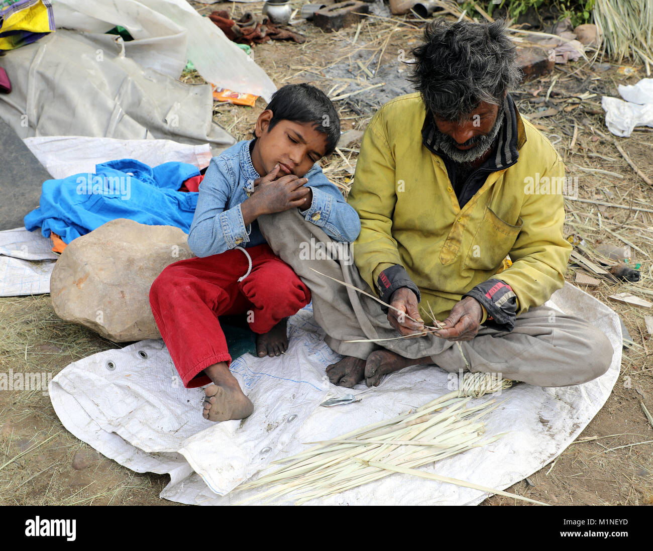 Jammu, India. 30th Jan, 2018. A non local workers busy in making brooms ...