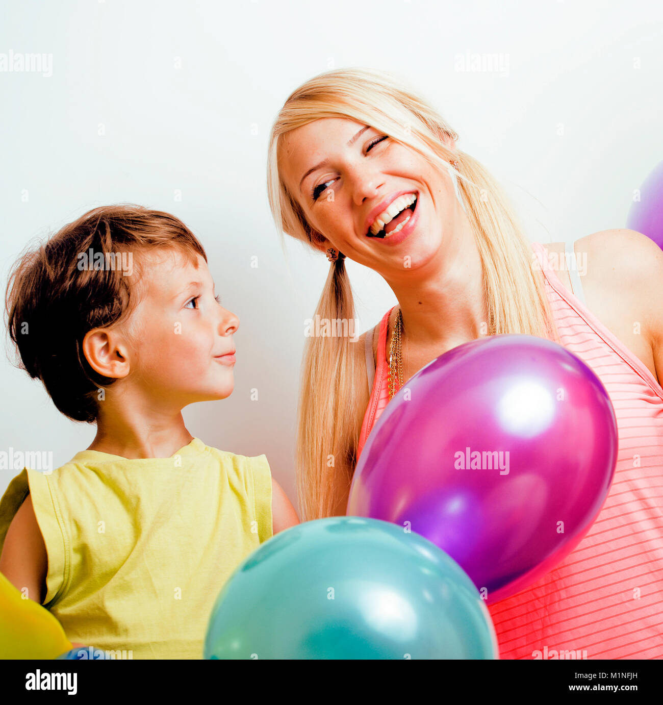 pretty real family with color balloons on white background, blon Stock ...