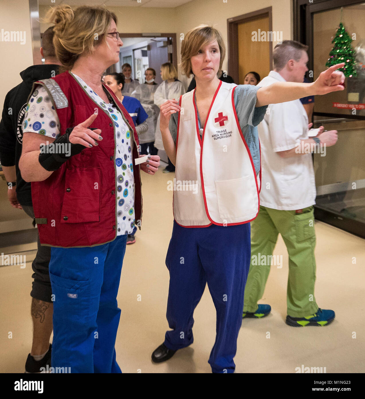 (From Right) Nursing Supervisor Jaclyn Castano directs patient movement ...