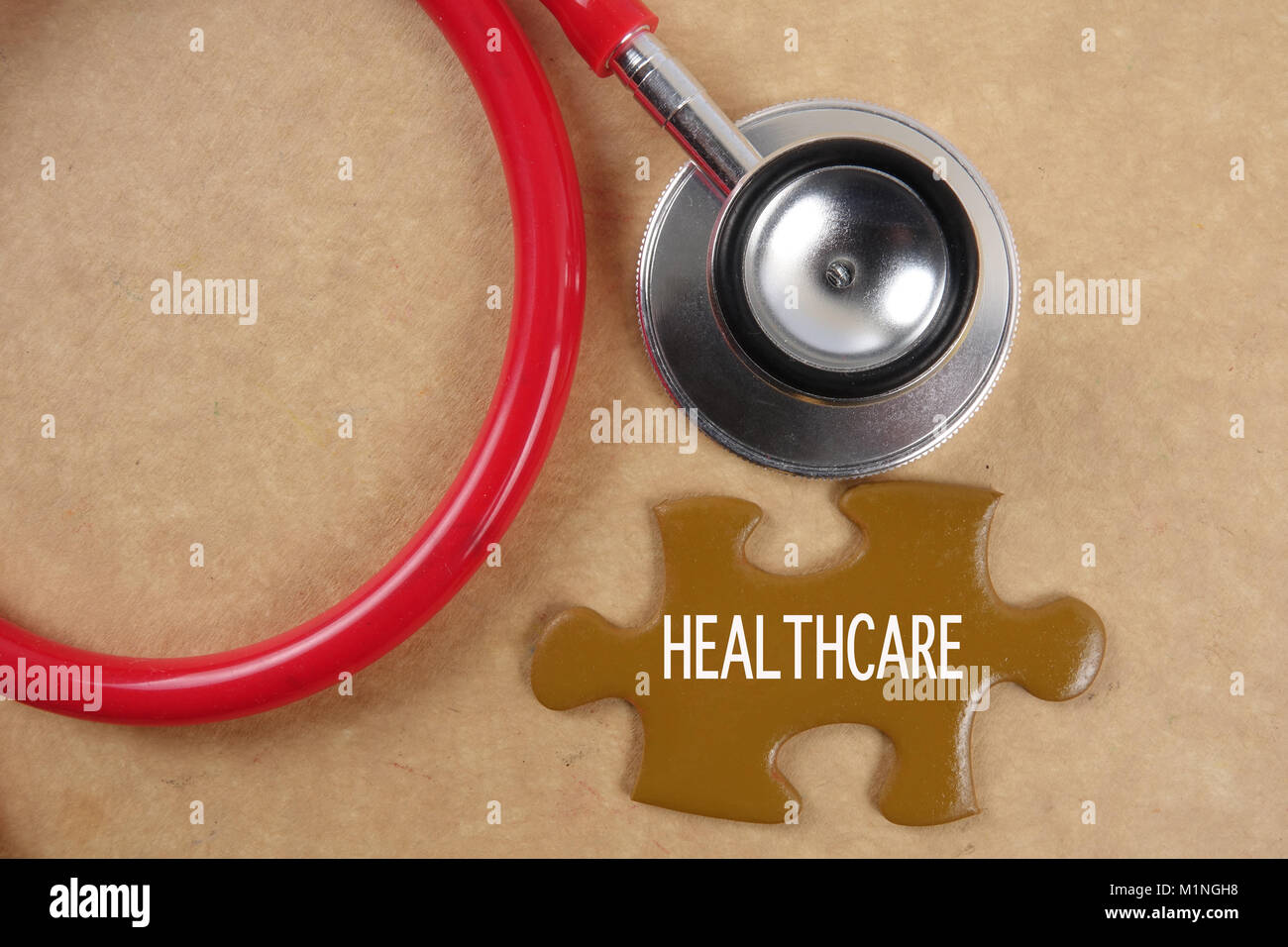 MEDICAL CONCEPT with HEALTHCARE words on the gold jigsaw puzzle Stock ...