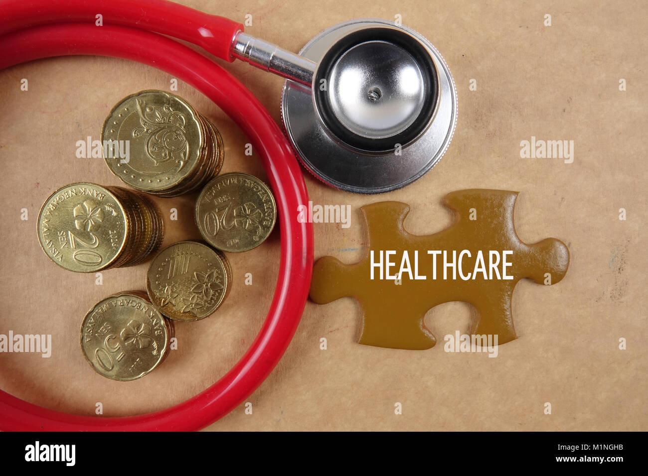 MEDICAL CONCEPT with HEALTHCARE words on the gold jigsaw puzzle Stock ...