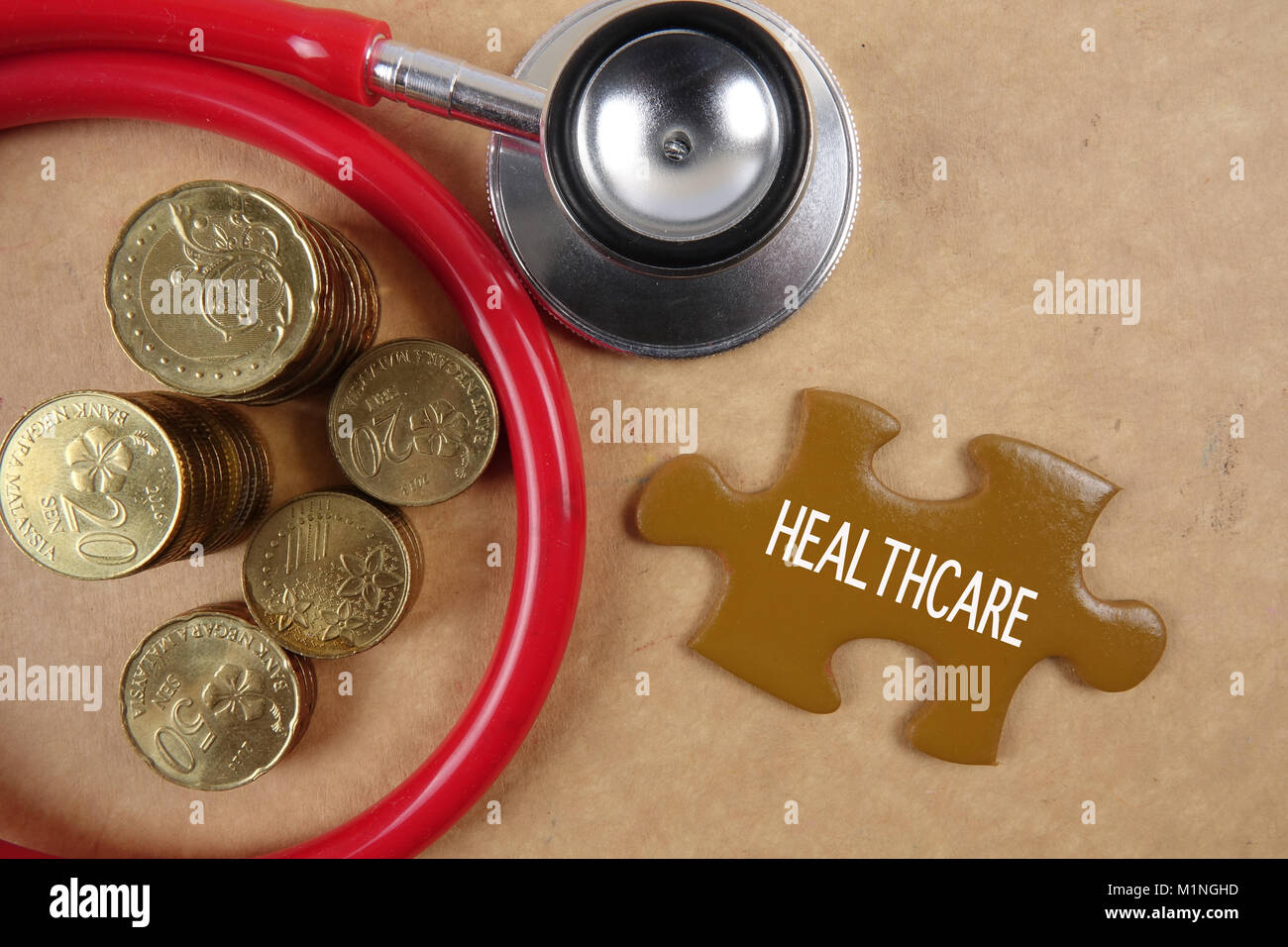 MEDICAL CONCEPT with HEALTHCARE words on the gold jigsaw puzzle Stock ...