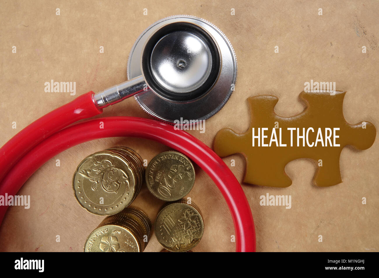 MEDICAL CONCEPT with HEALTHCARE words on the gold jigsaw puzzle Stock ...