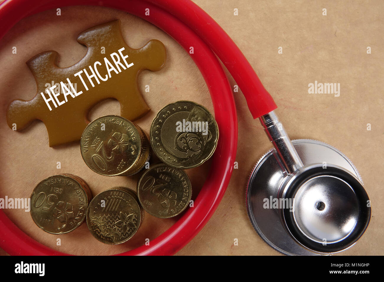 MEDICAL CONCEPT with HEALTHCARE words on the gold jigsaw puzzle Stock ...