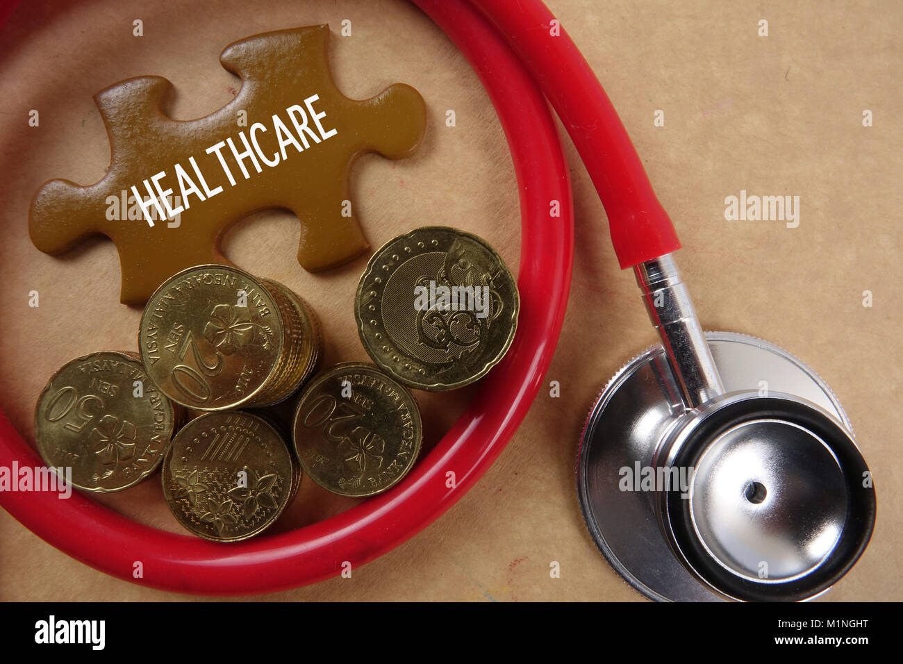 MEDICAL CONCEPT with HEALTHCARE words on the gold jigsaw puzzle Stock ...