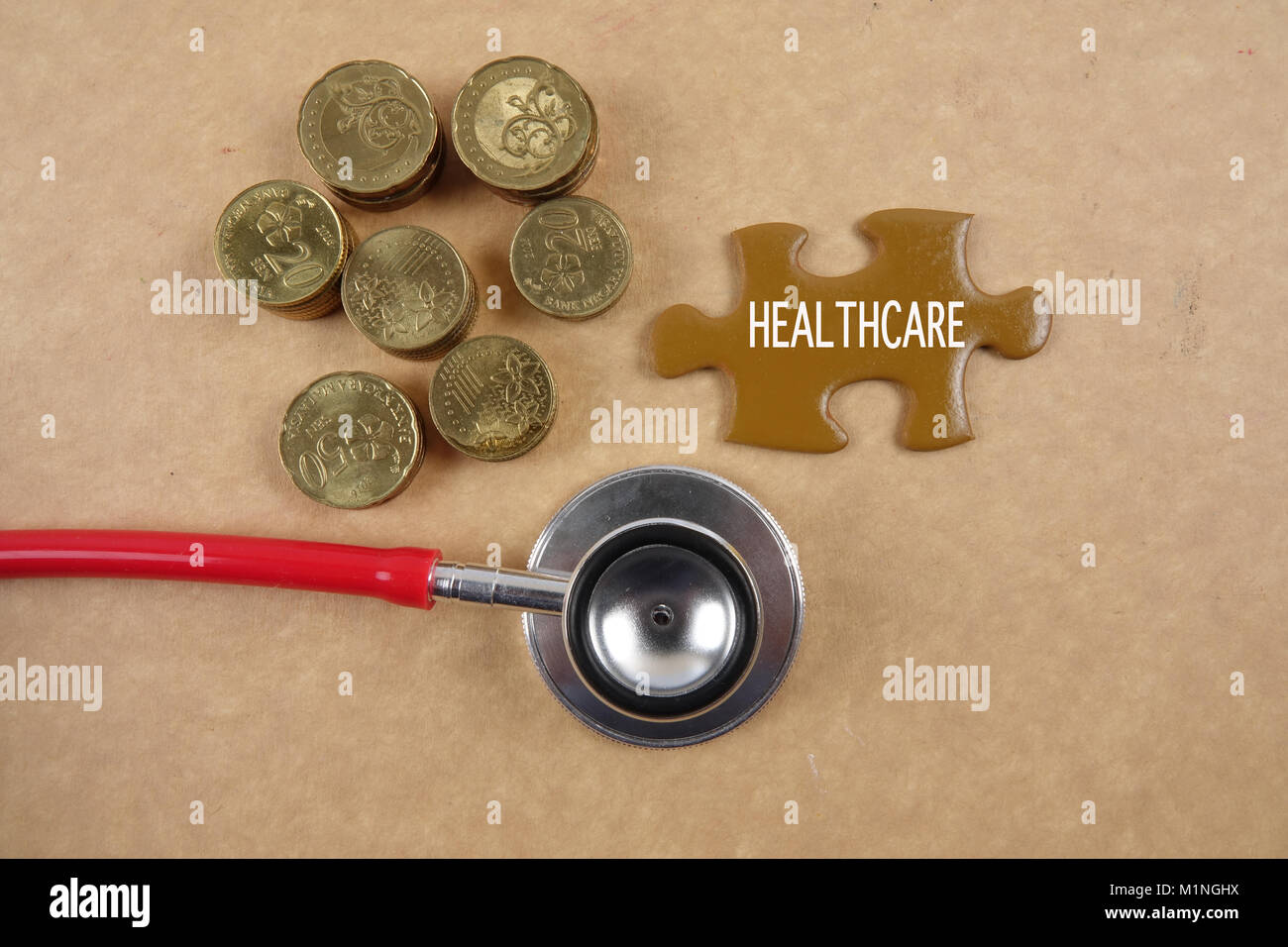 MEDICAL CONCEPT with HEALTHCARE words on the gold jigsaw puzzle Stock ...