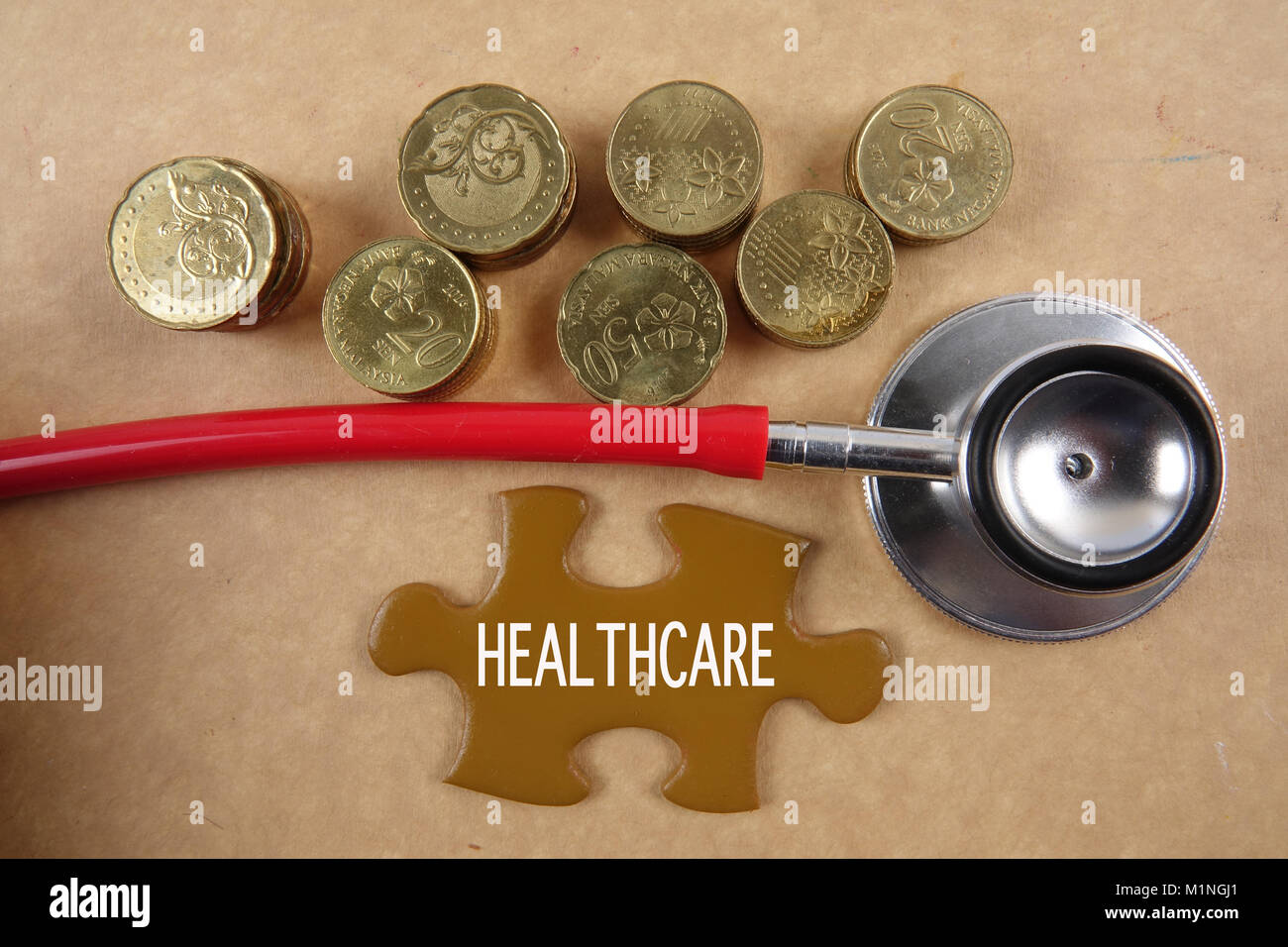 MEDICAL CONCEPT with HEALTHCARE words on the gold jigsaw puzzle Stock ...