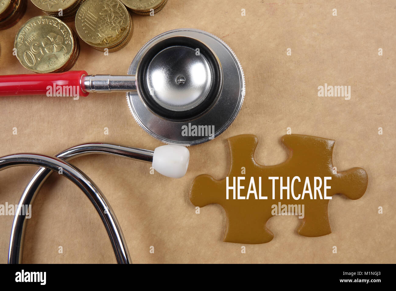 MEDICAL CONCEPT with HEALTHCARE words on the gold jigsaw puzzle Stock ...