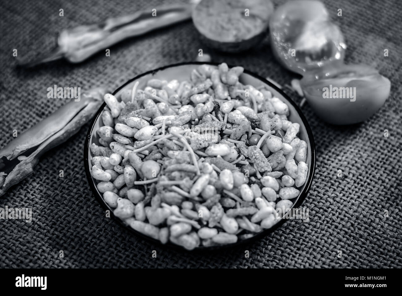 Close up Indian snack mix chevdo in a plate with green chillies Stock ...