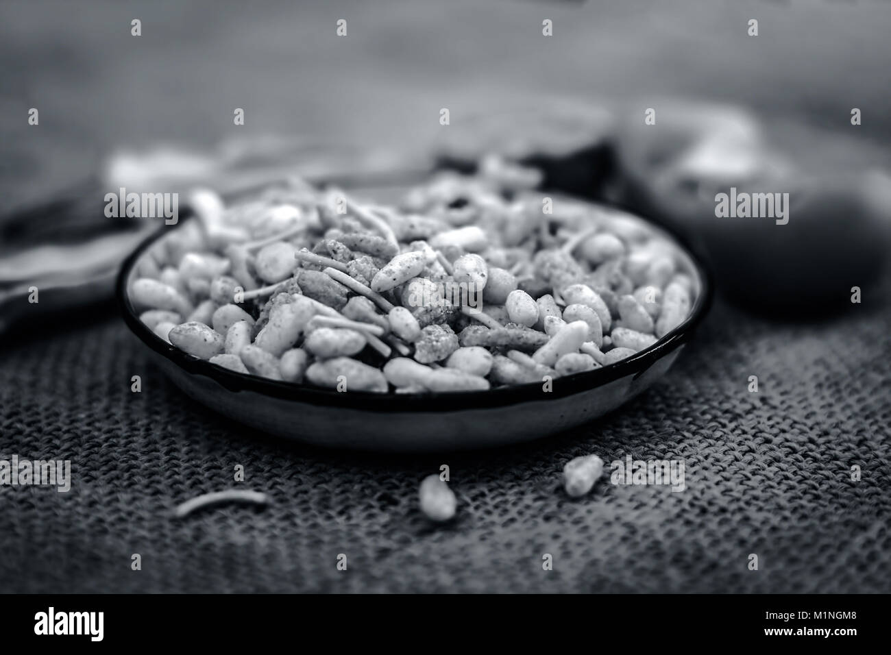 Close up Indian snack mix chevdo in a plate with green chillies Stock ...