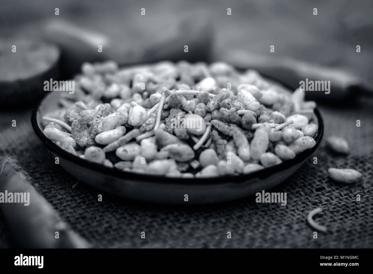 Close up Indian snack mix chevdo in a plate with green chillies Stock ...