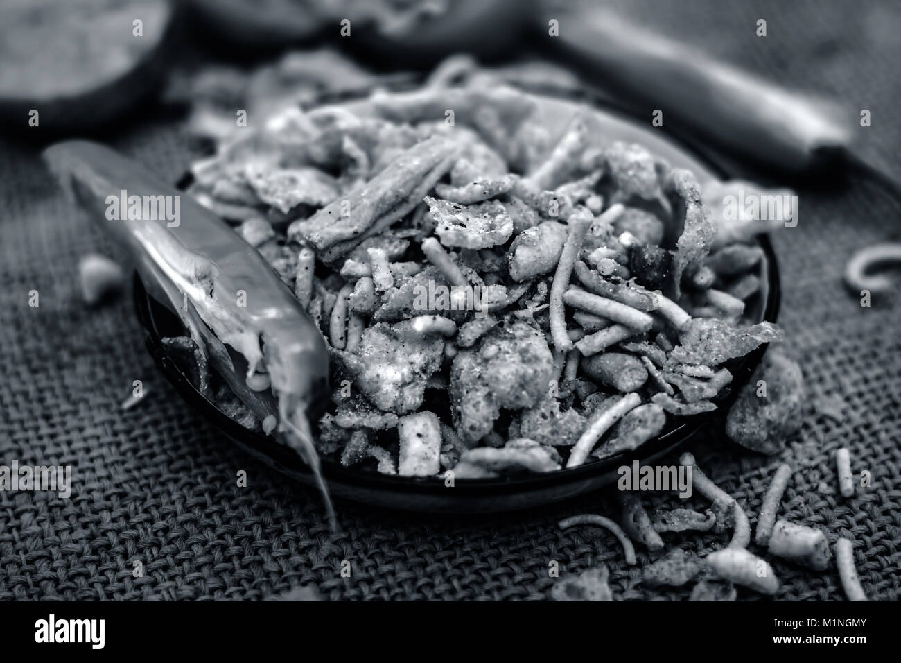 Close up Indian snack mix chevdo in a plate with green chillies Stock ...