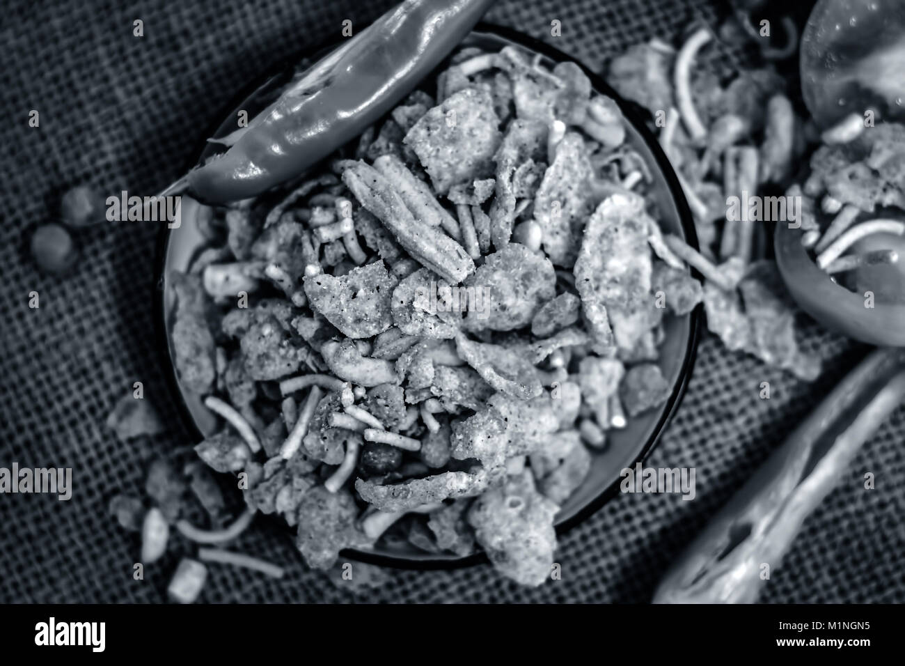 Close up Indian snack mix chevdo in a plate with green chillies Stock ...