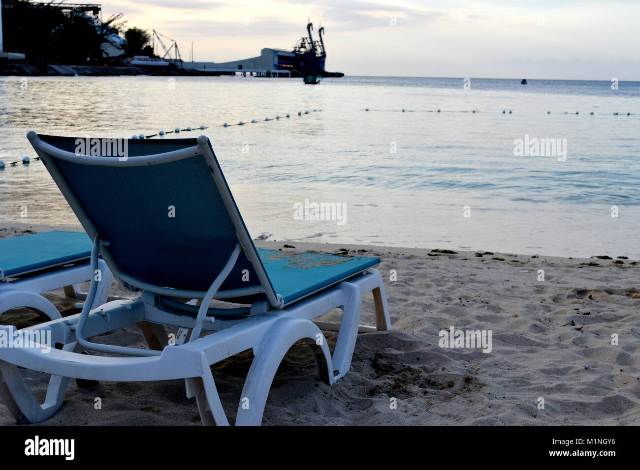 Lounge Chairs On Beach Stock Photo - Alamy