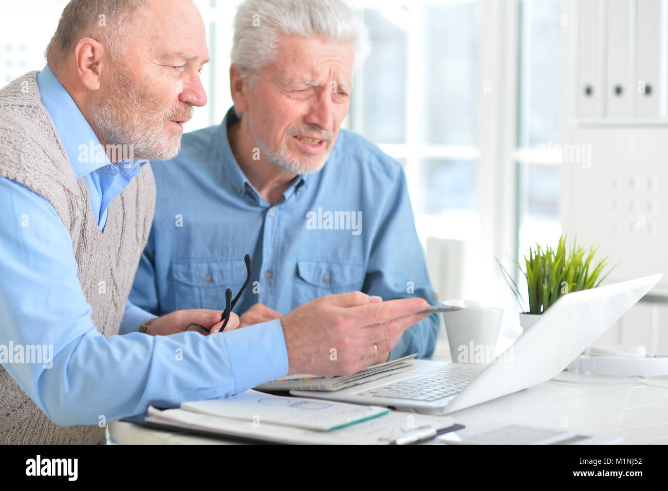 men working on laptop Stock Photo - Alamy