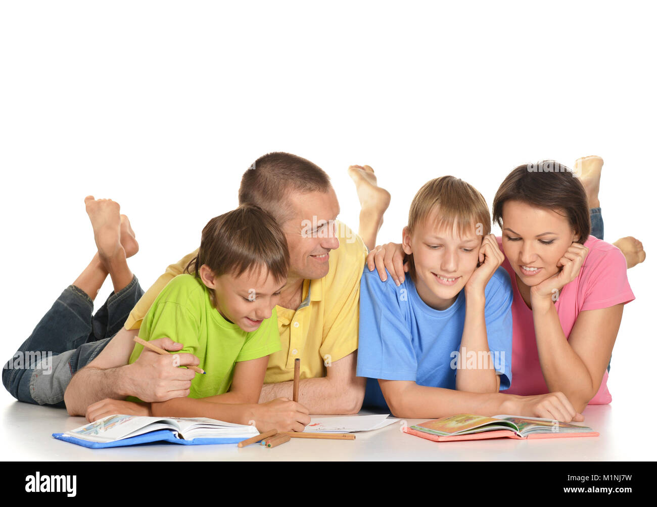 Parents help children do homework Stock Photo - Alamy
