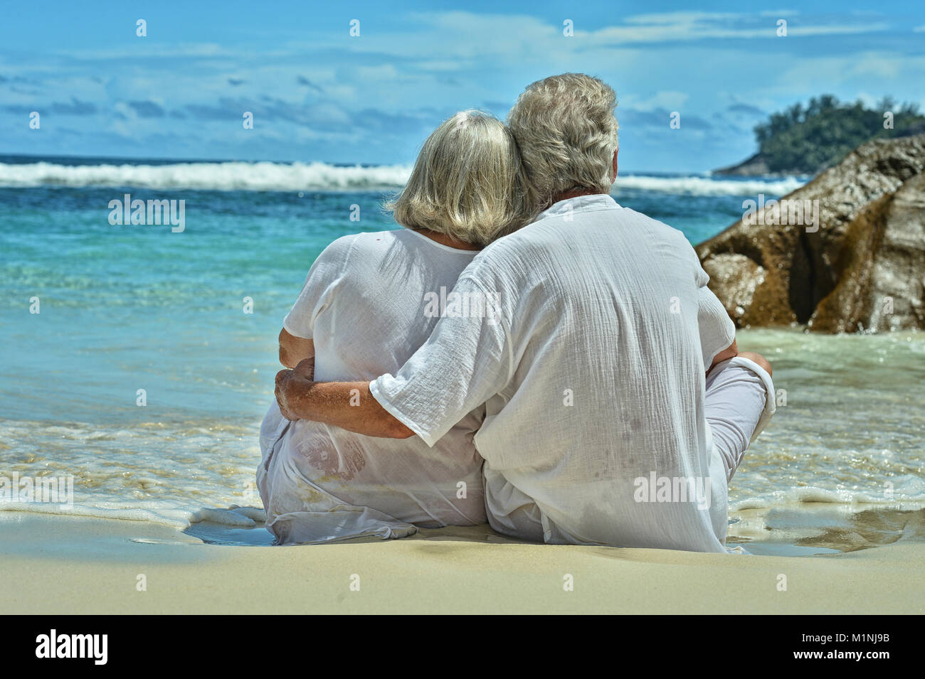 elderly couple rest at tropical resort Stock Photo - Alamy