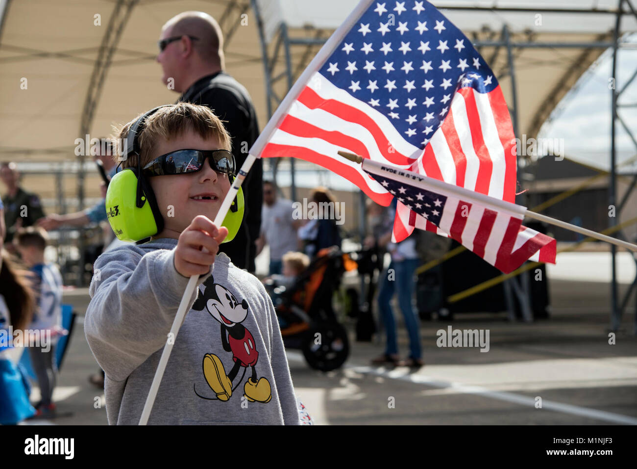 A child waves a flag during a redeployment of the 74th Fighter Squadron ...