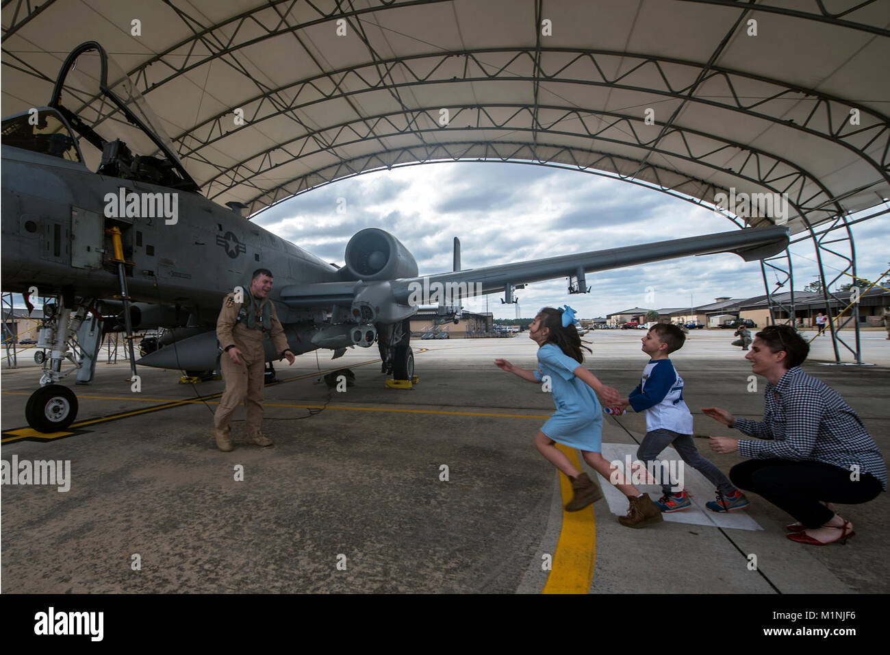 Lt. Col Craig Morash, 74th Fighter Squadron commander, prepares to hug ...