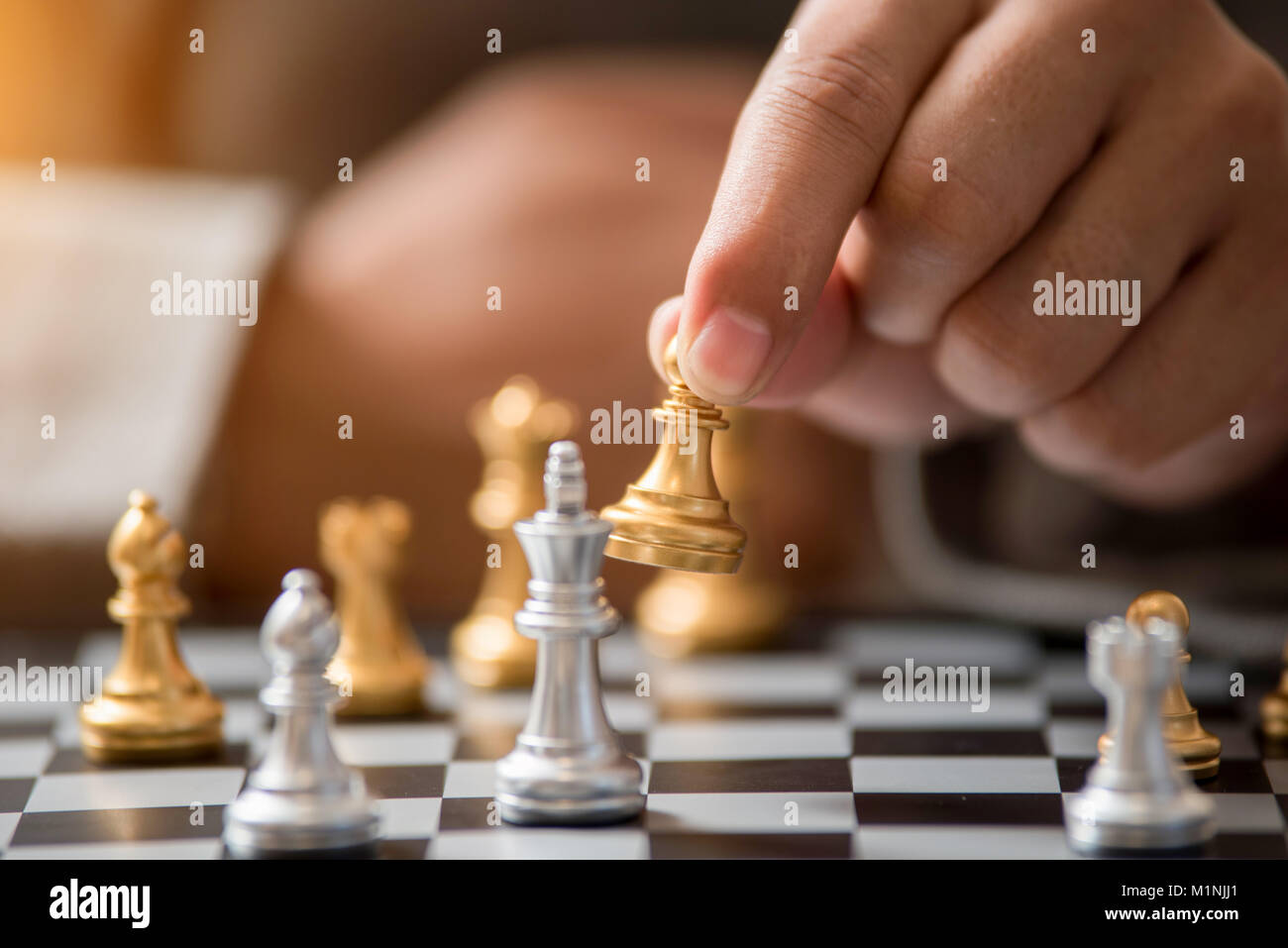 Businessman hand with businessman goal with chess Stock Photo - Alamy