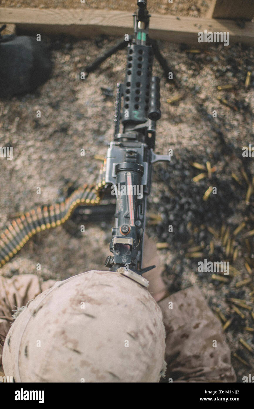 A U.S. Marine with Task Force Southwest fires the M-249B as part of the ...