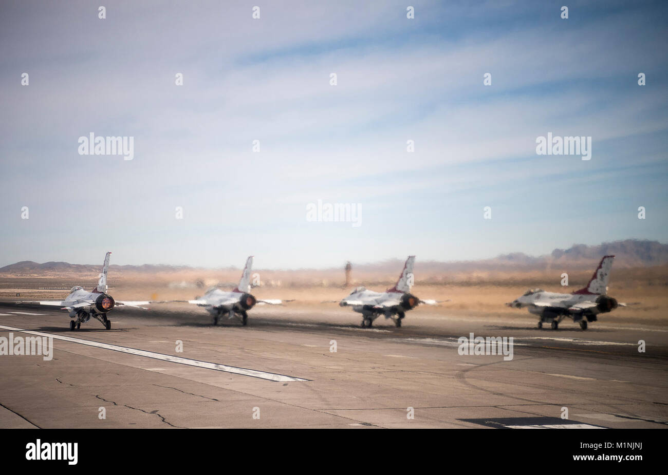 The Thunderbirds Diamond formation pilots launch from the runway at ...