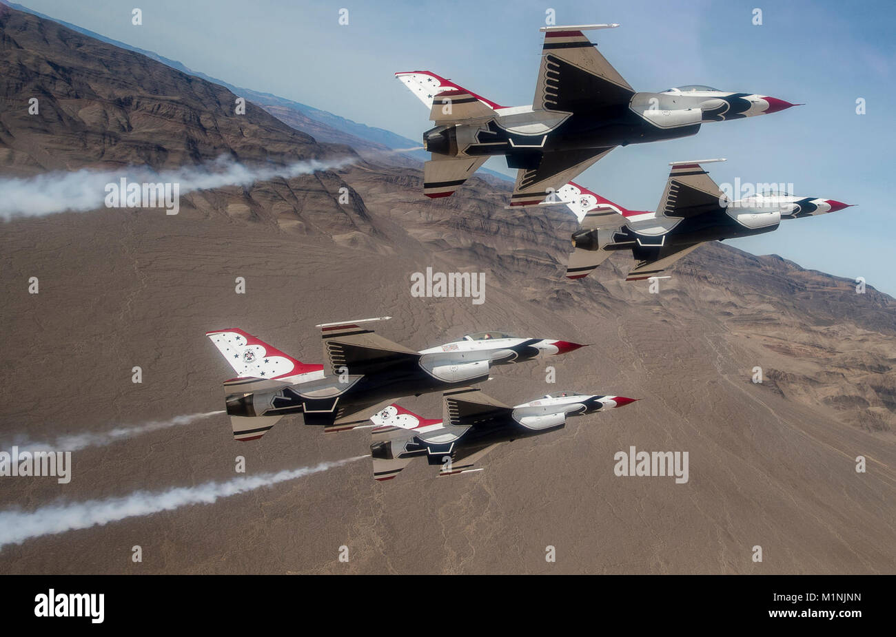 The Thunderbirds Diamond formation pilots perform the Diamond Roll ...