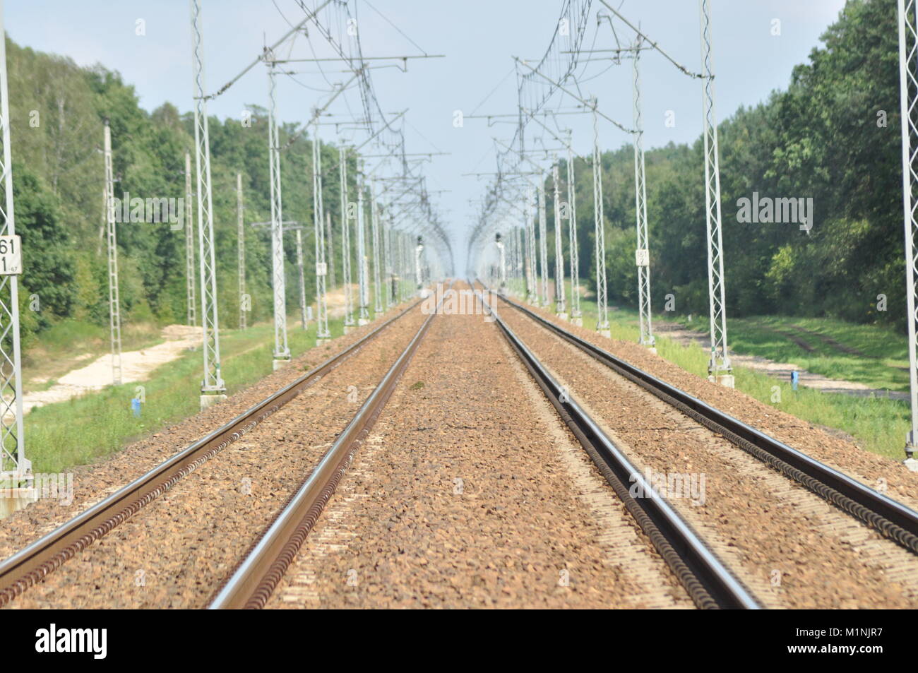 The railway line. Electric traction. Tracks for trains Stock Photo - Alamy