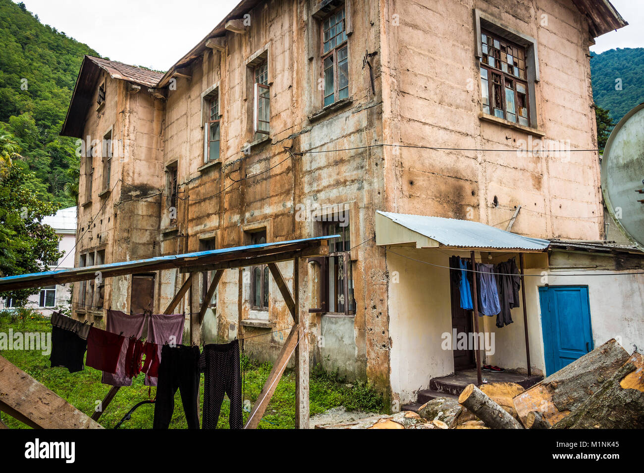 An old two-story concrete dwelling house Stock Photo - Alamy