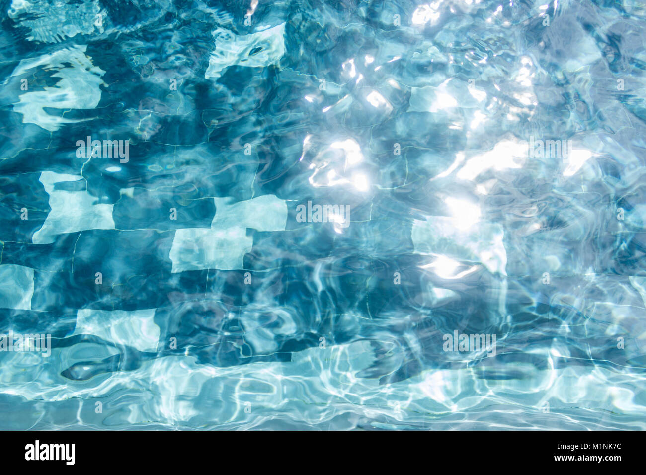 Abstract ripple swimming pool water and sun reflection Stock Photo - Alamy