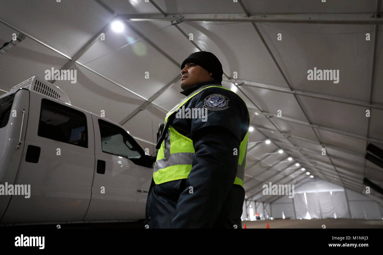 An officer with U.S. Customs and Border Protection, Office of Field ...