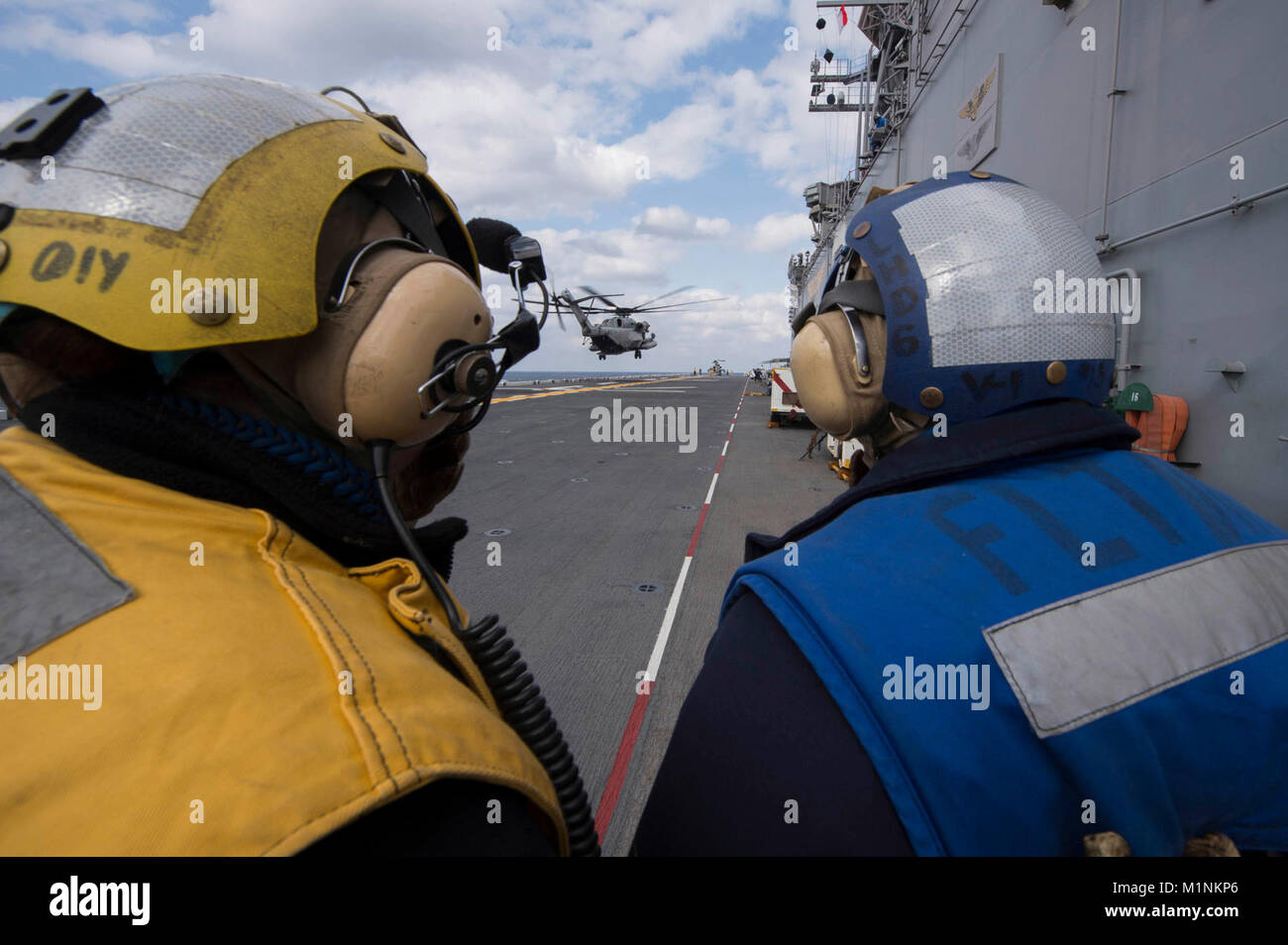 PHILIPPINE SEA (Jan. 30, 2018) Sailors observe a CH-53E Super Stallion ...