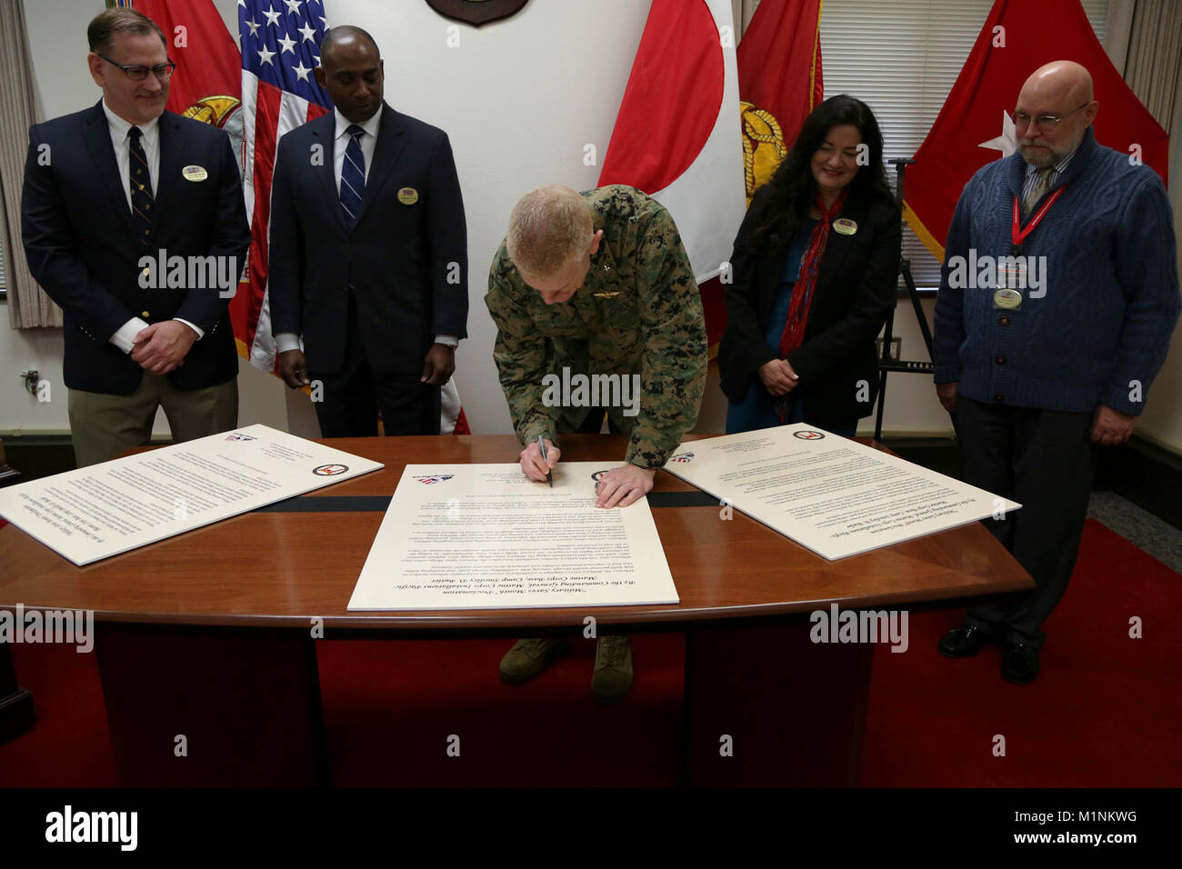 CAMP FOSTER, OKINAWA, Japan – Brig. Gen. Paul Rock Jr. signs the ...