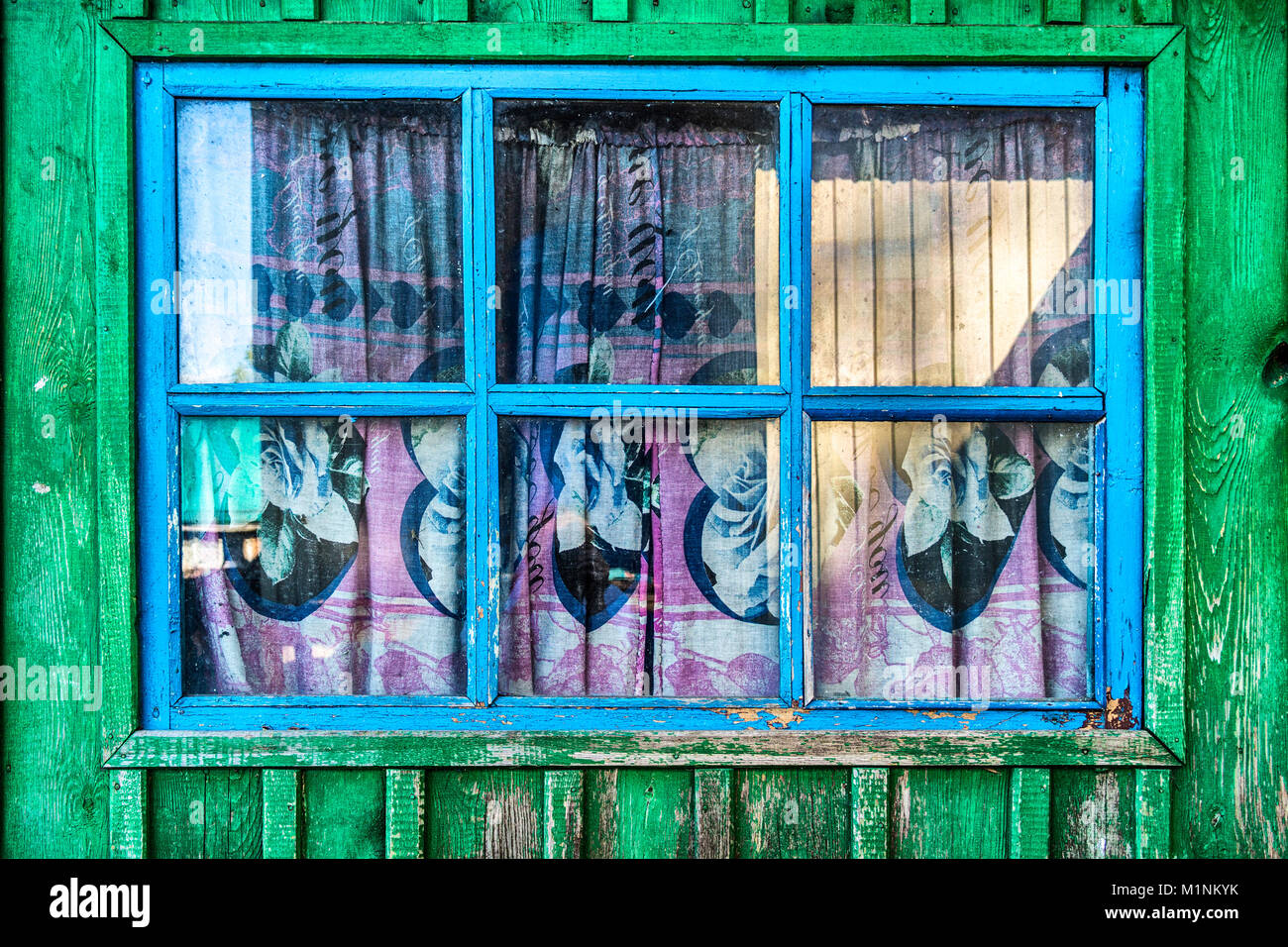 Bright colored window of an old wooden house close-up Stock Photo - Alamy