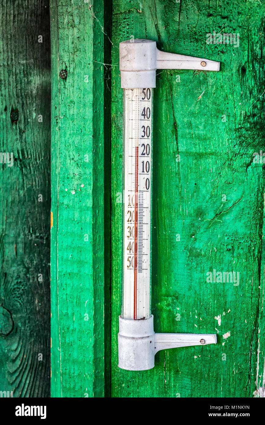 Thermometer on the wall of an old rustic wooden house close-up Stock ...