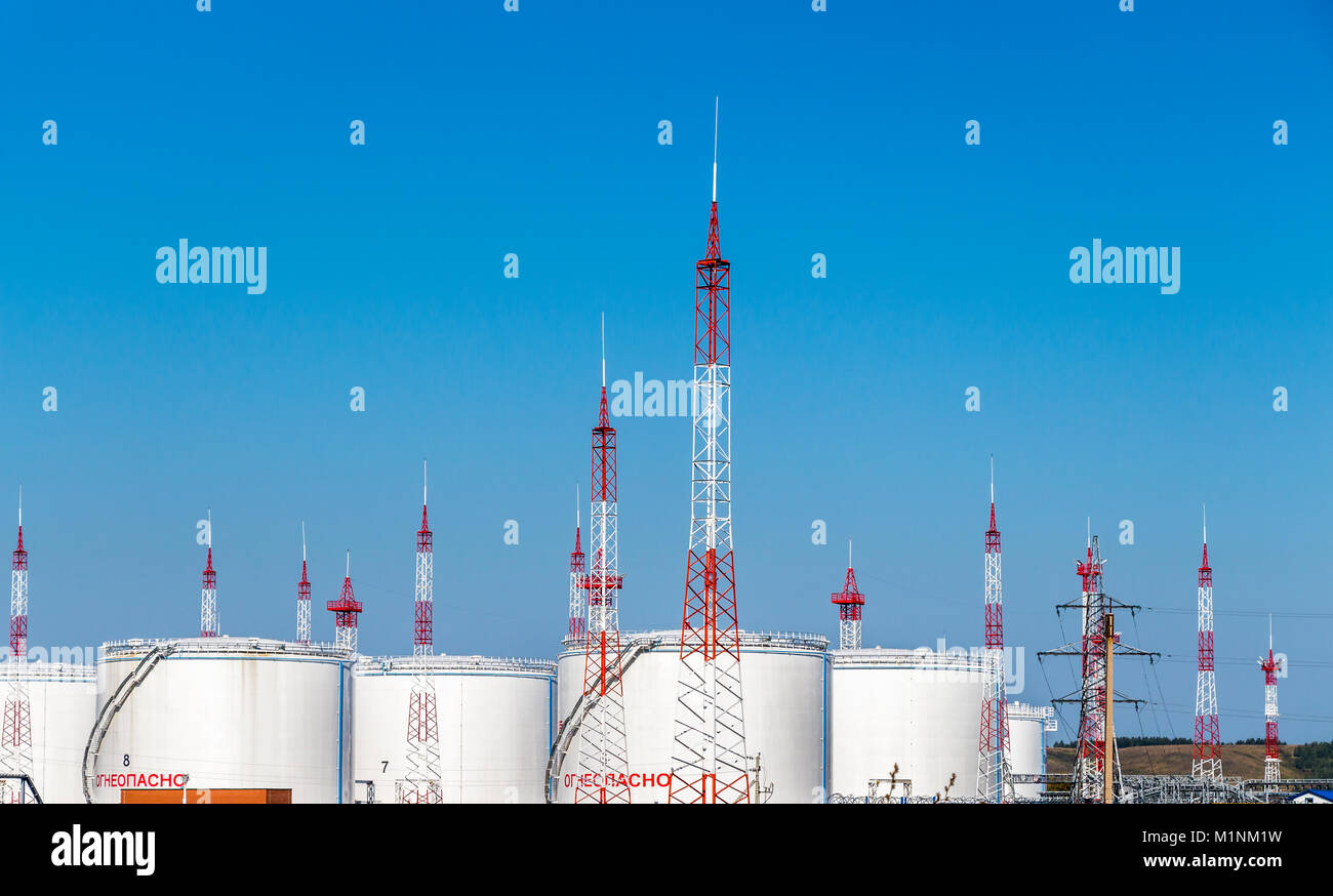 White large oil storage tanks against the blue sky Stock Photo - Alamy
