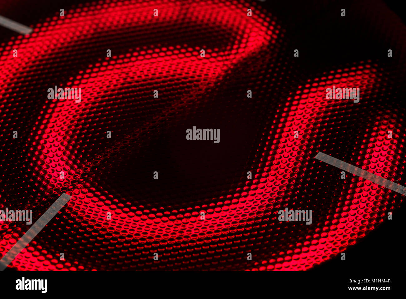 The red-hot red-burner induction hob close up Stock Photo - Alamy