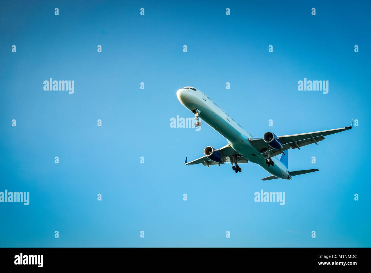 fly aircraft blue sky background Stock Photo - Alamy