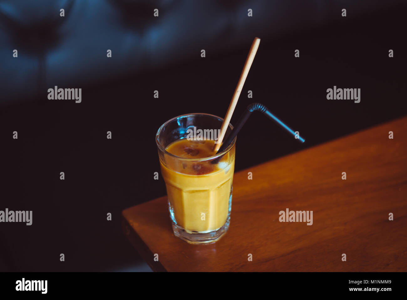 Iced coffee on a wooden table Stock Photo - Alamy