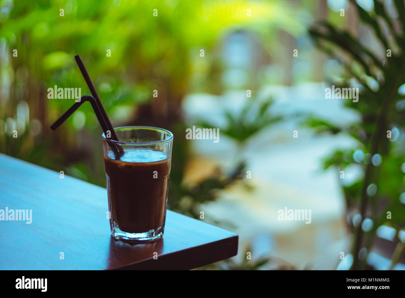 Iced coffee on a wooden table Stock Photo - Alamy